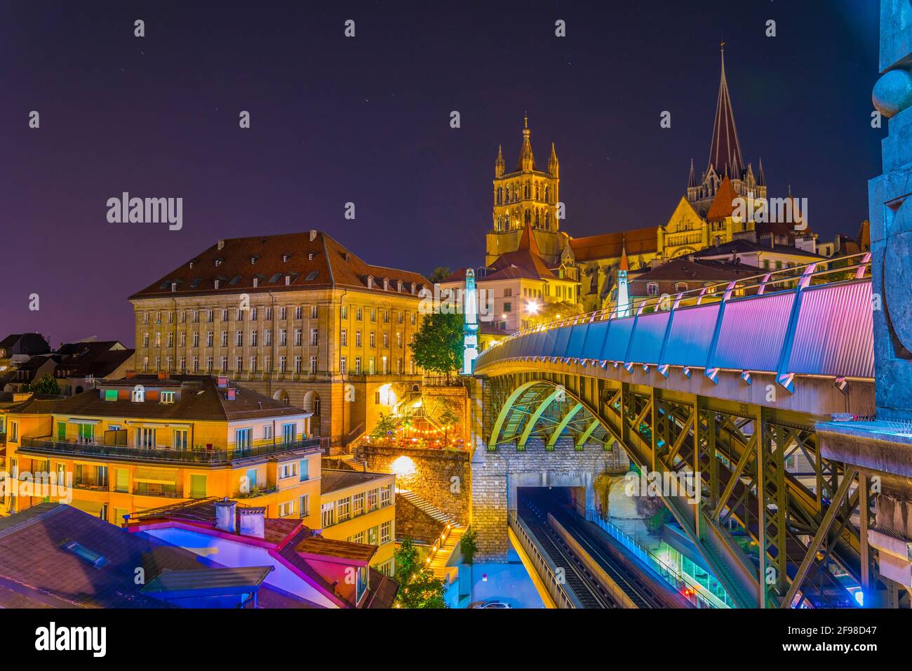 Night view of the Lausanne gothic cathedral Behind Charles Bessieres ...