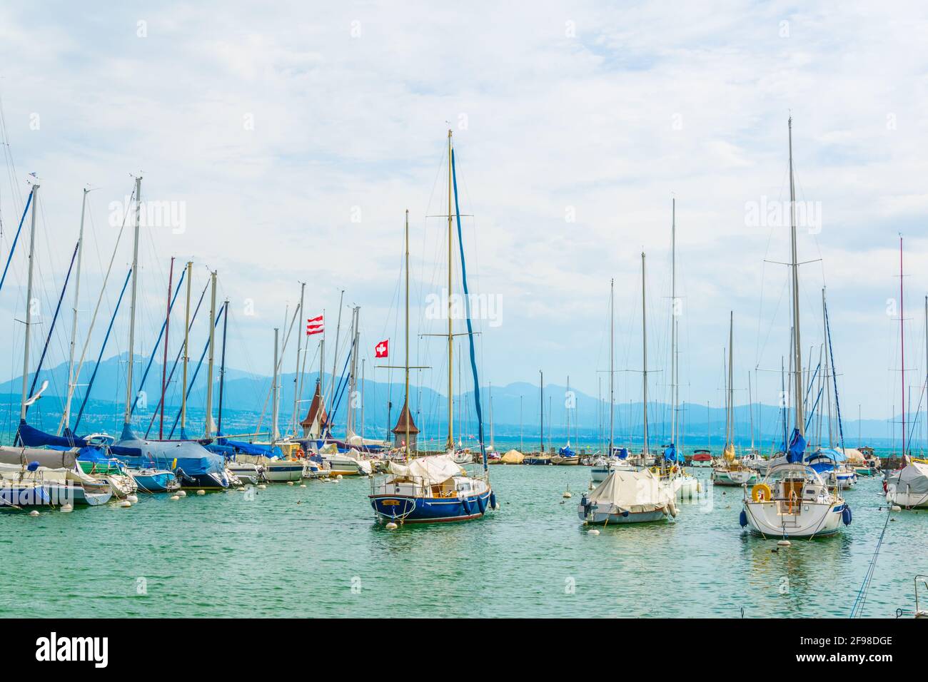 Boats floating on Geneva lake also called as Lac Leman in Switzerland ...
