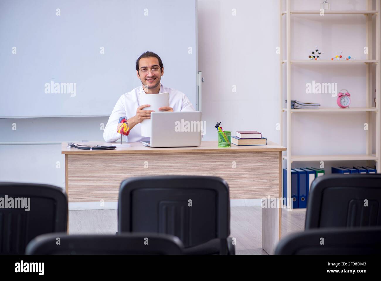 Young doctor giving seminar in the classroom Stock Photo - Alamy