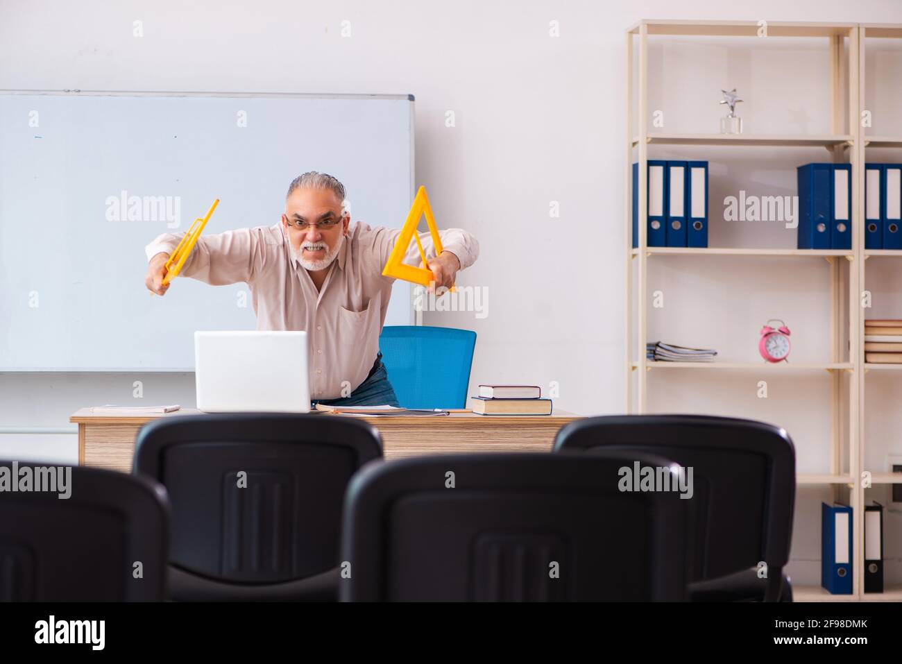 Angry teacher and ruler hi-res stock photography and images - Alamy