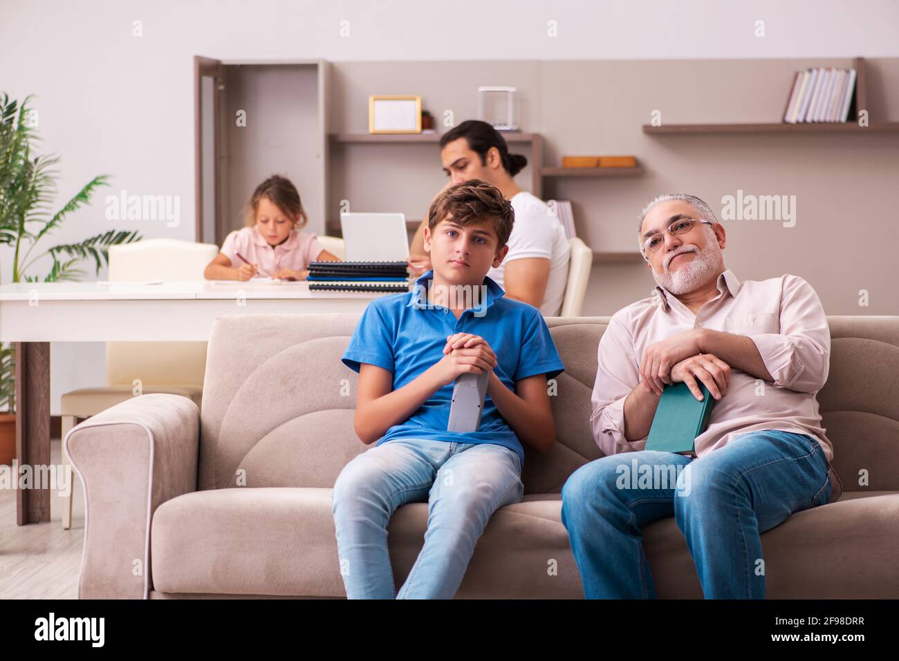 Three generations at home in early development concept Stock Photo - Alamy