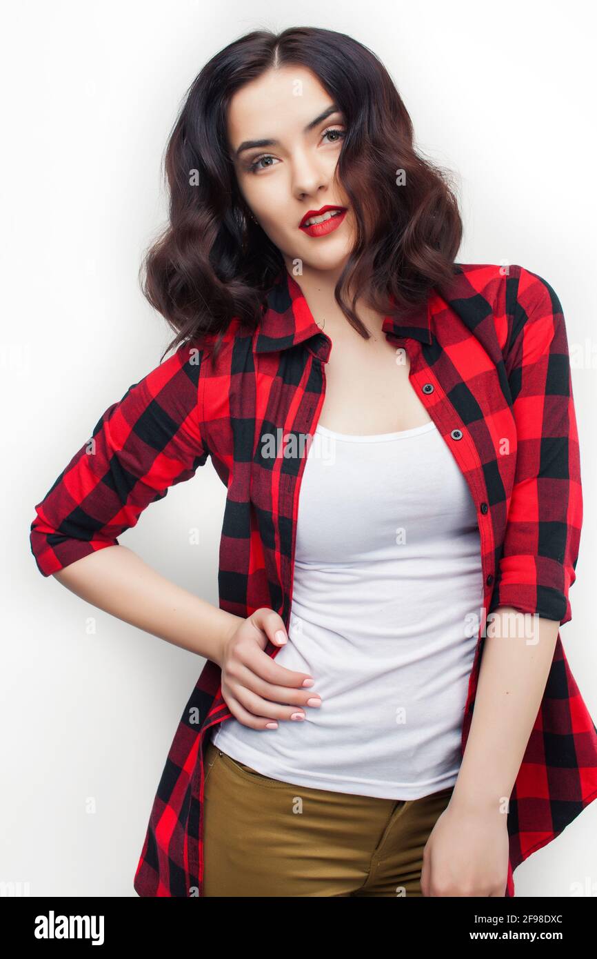 young pretty stylish hipster girl posing emotional isolated on white ...