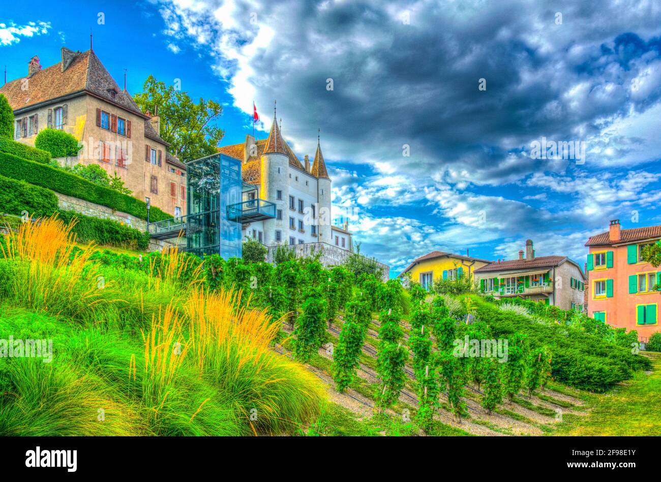 White Chateau de Nyon in Switzerland viewed behind a green garden Stock ...