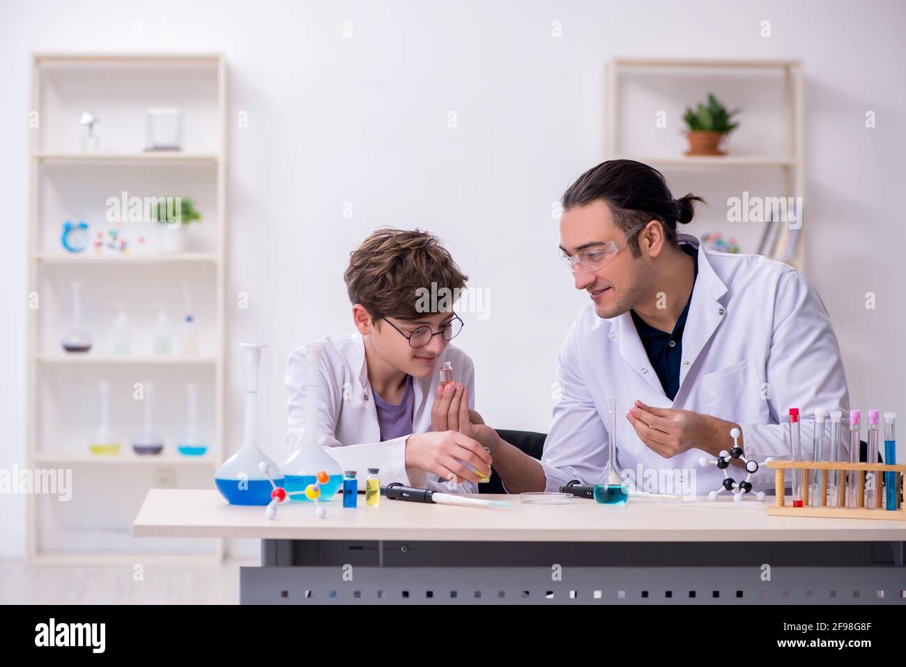 Young father and son chemists in the laboratory Stock Photo - Alamy