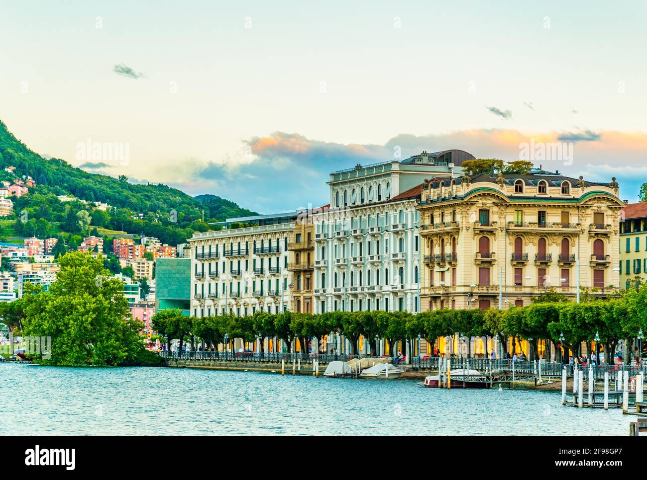 Sunset view of old town of Lugano facing the Lugano lake in Switzerland ...