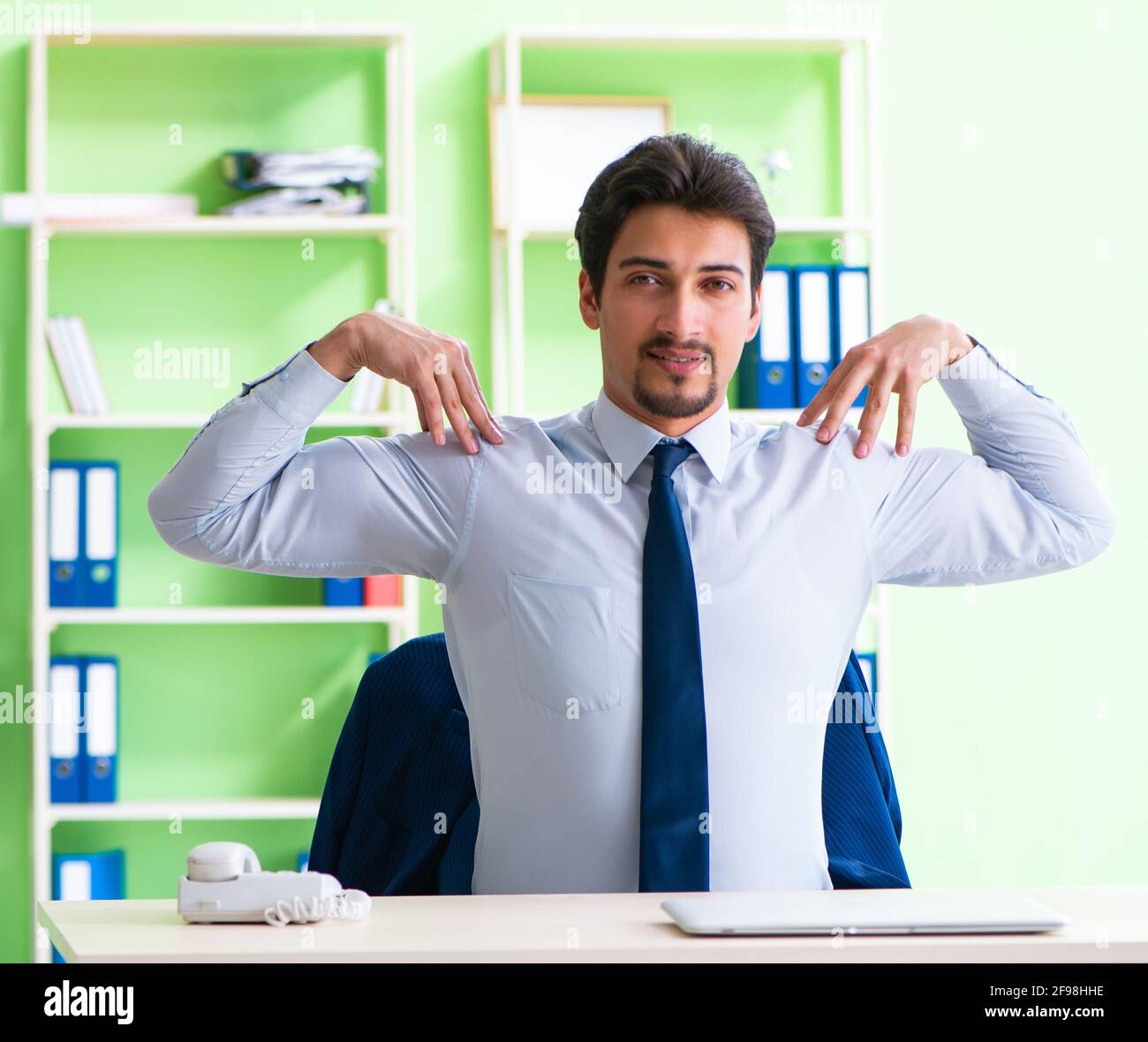 The employee doing exercises during break at work Stock Photo - Alamy