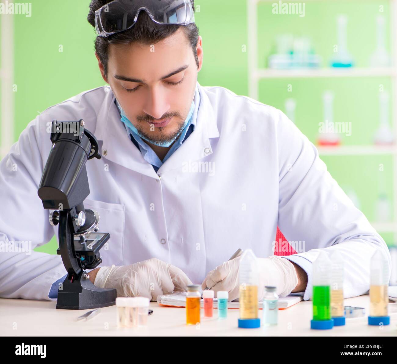 The man chemist working in the lab Stock Photo - Alamy