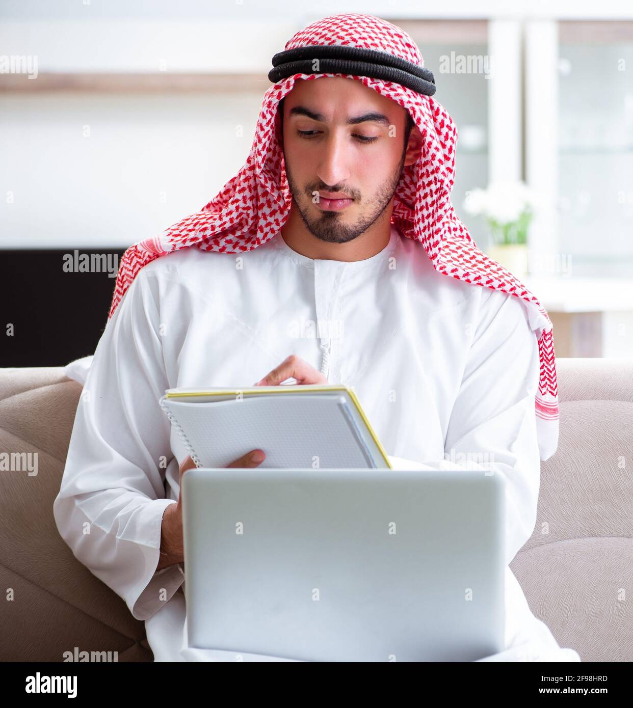The arab man working at home on his work Stock Photo - Alamy