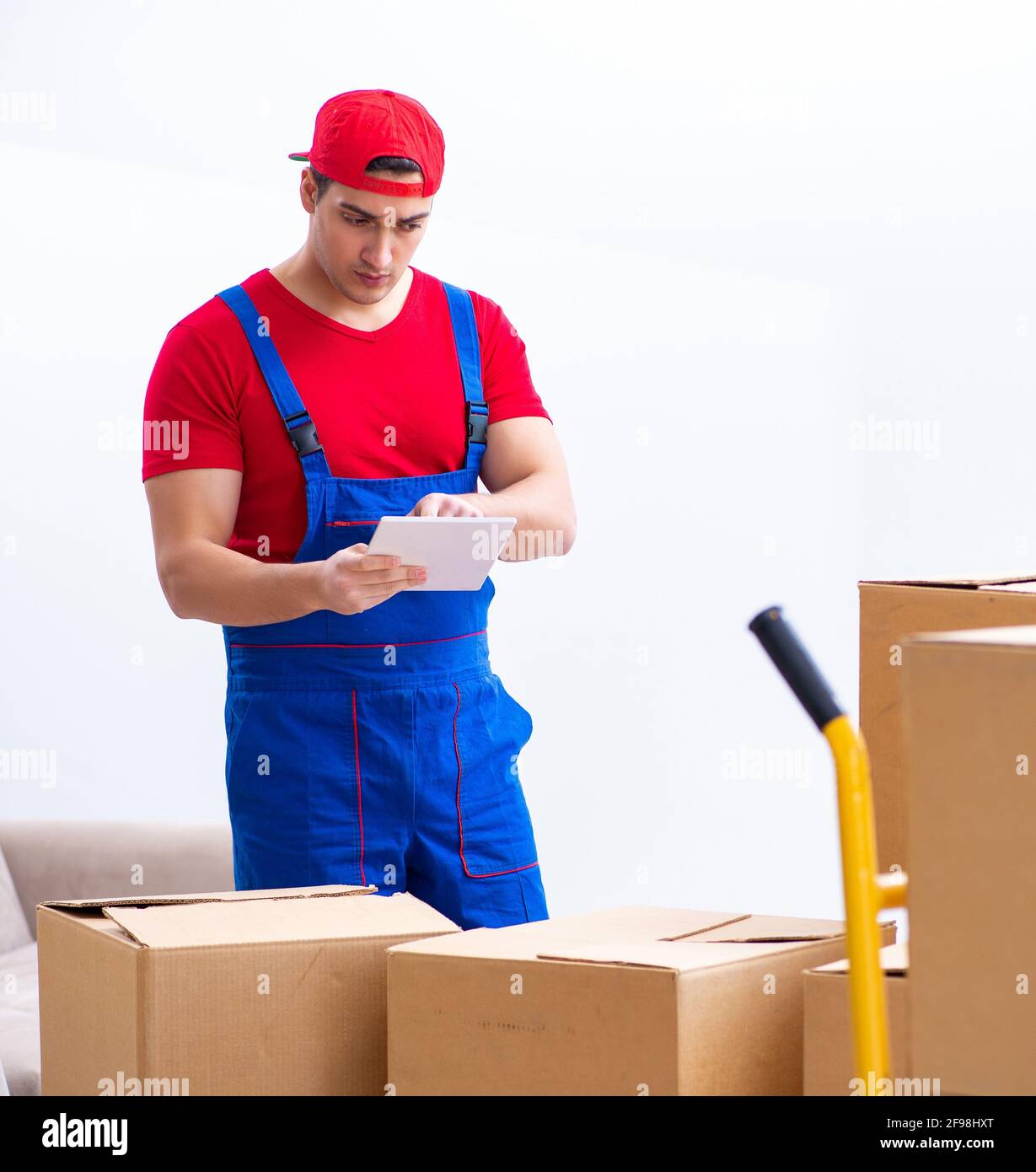 The contractor worker moving boxes during office move Stock Photo - Alamy