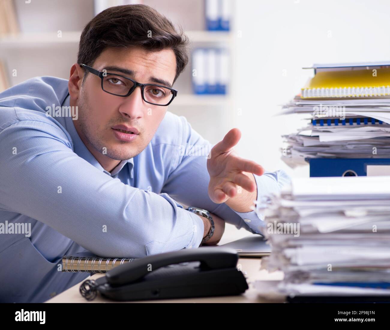 The extremely busy businessman working in office Stock Photo - Alamy