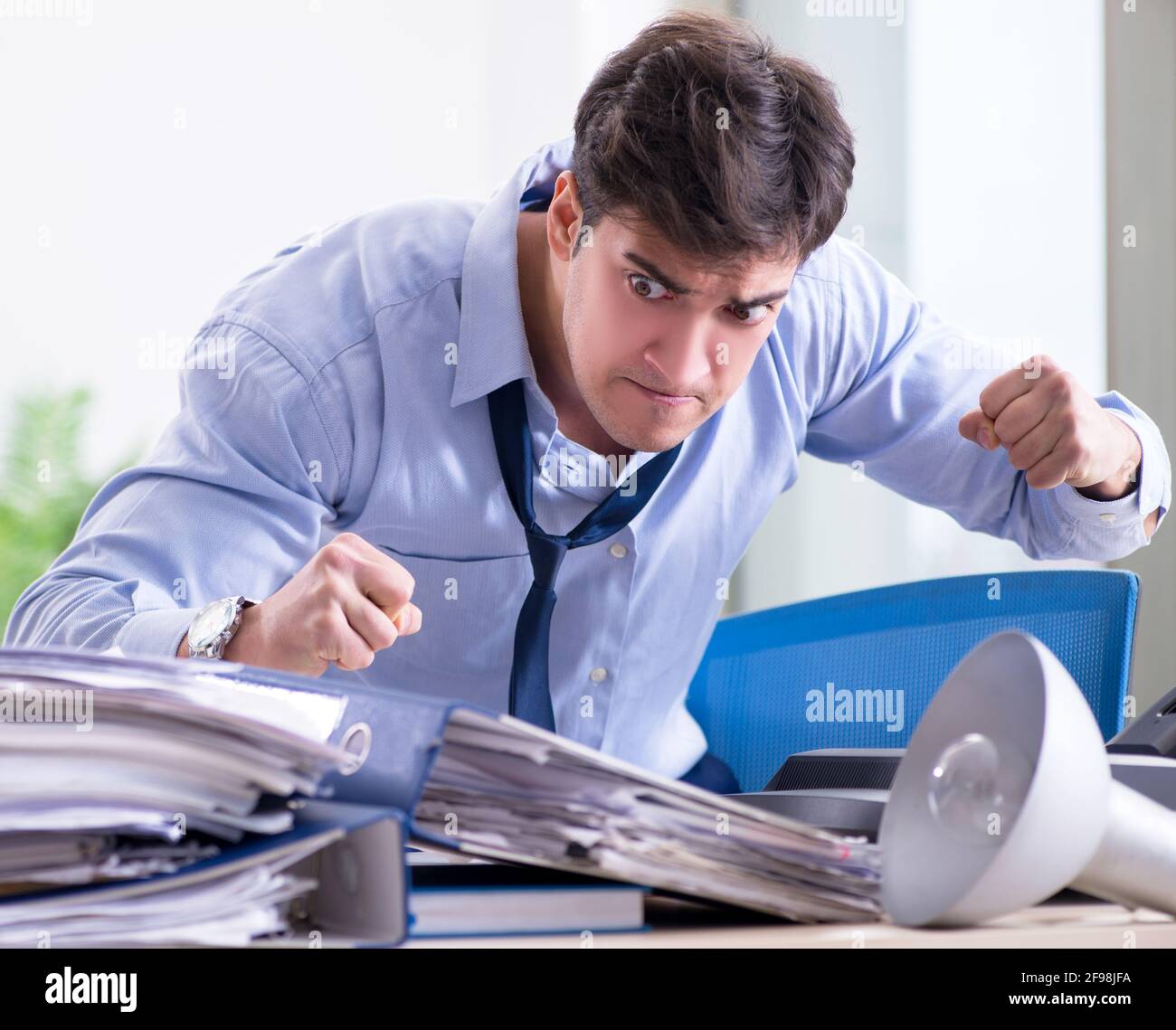 The angry businessman frustrated with too much work Stock Photo - Alamy