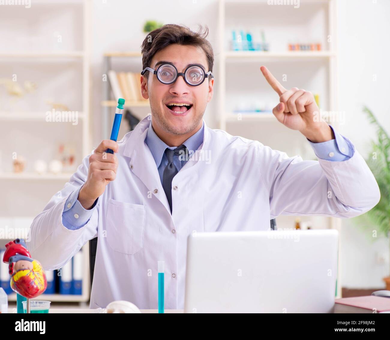 The funny doctor having fun in hospital lab Stock Photo - Alamy
