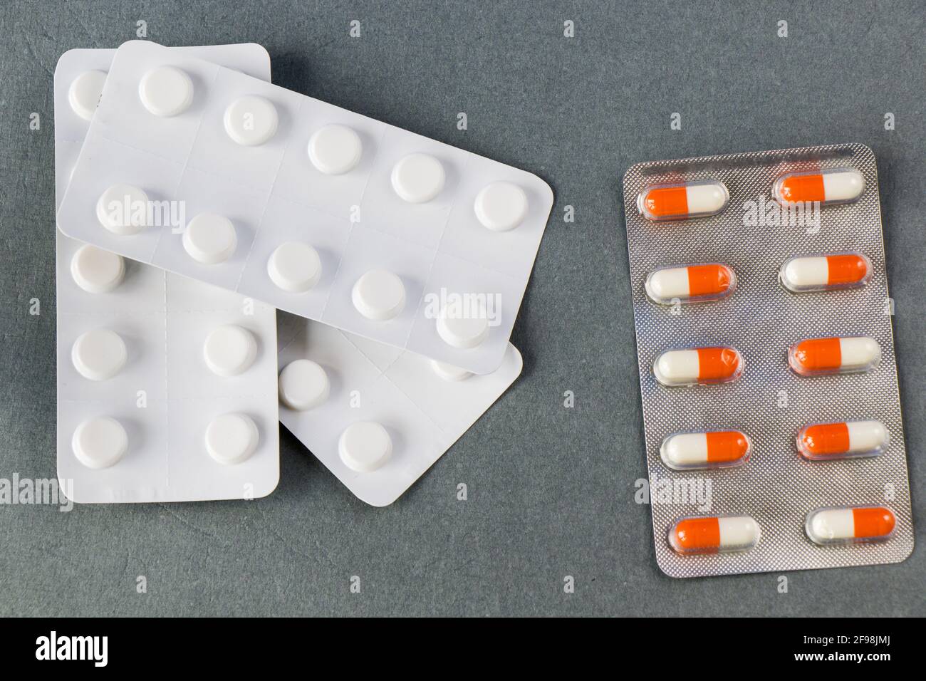 Top view of tablets on a gray surface Stock Photo - Alamy