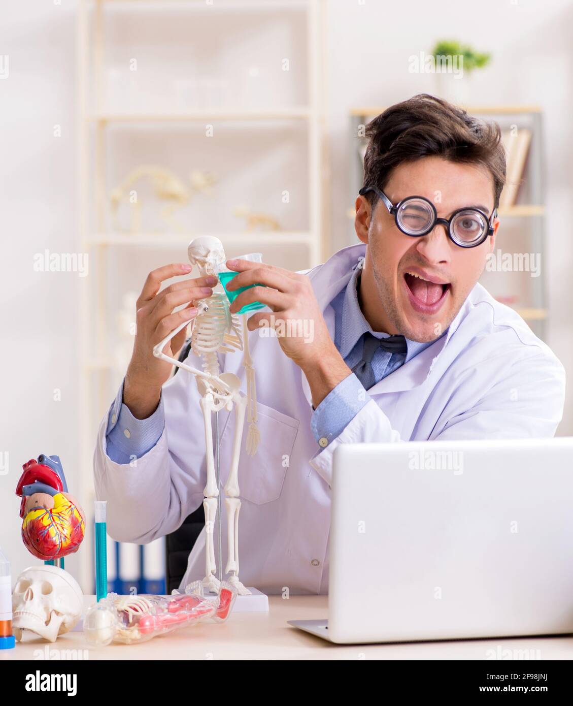 The funny doctor having fun in hospital lab Stock Photo - Alamy
