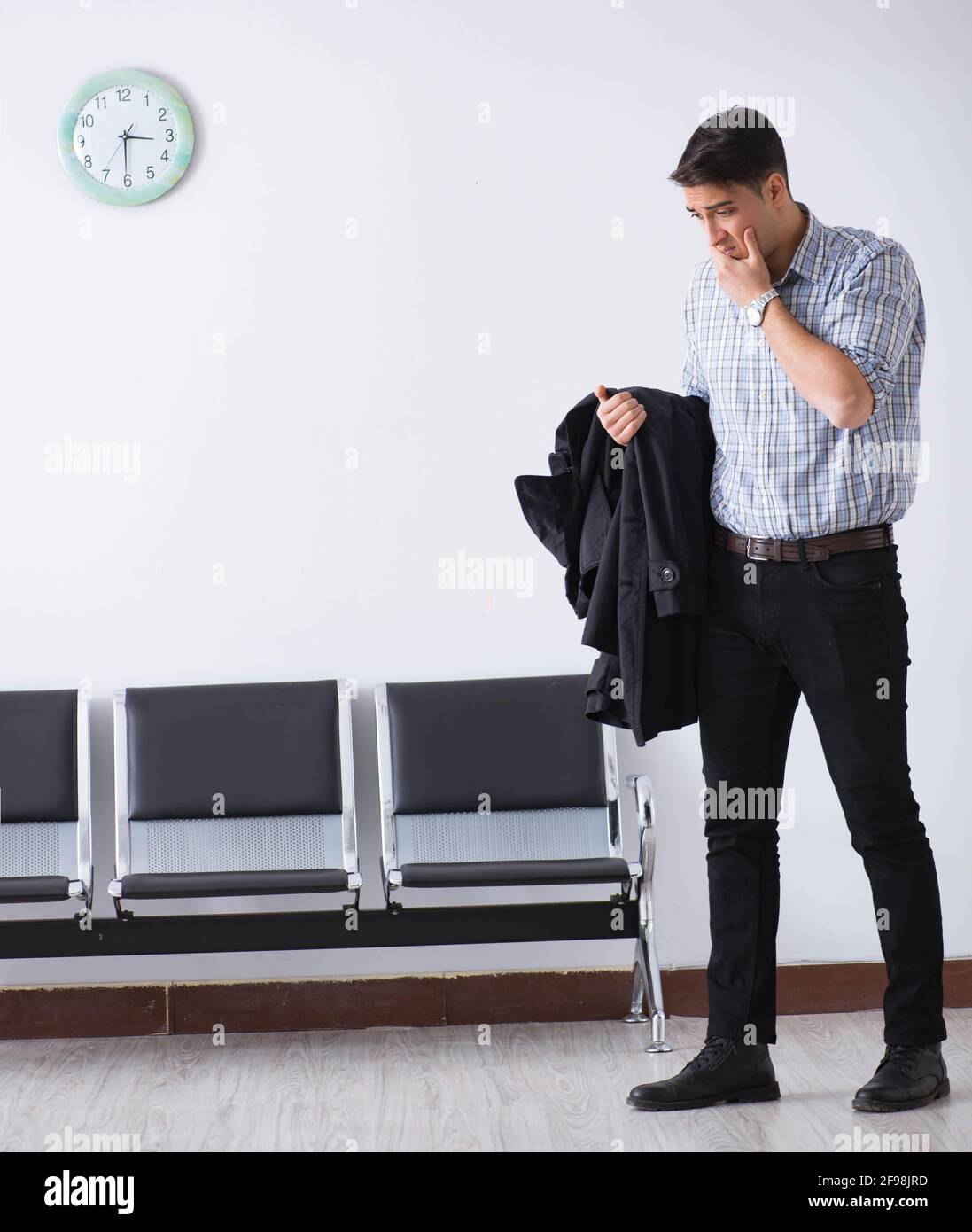 The man nervously impatiently waiting in the lobby Stock Photo - Alamy