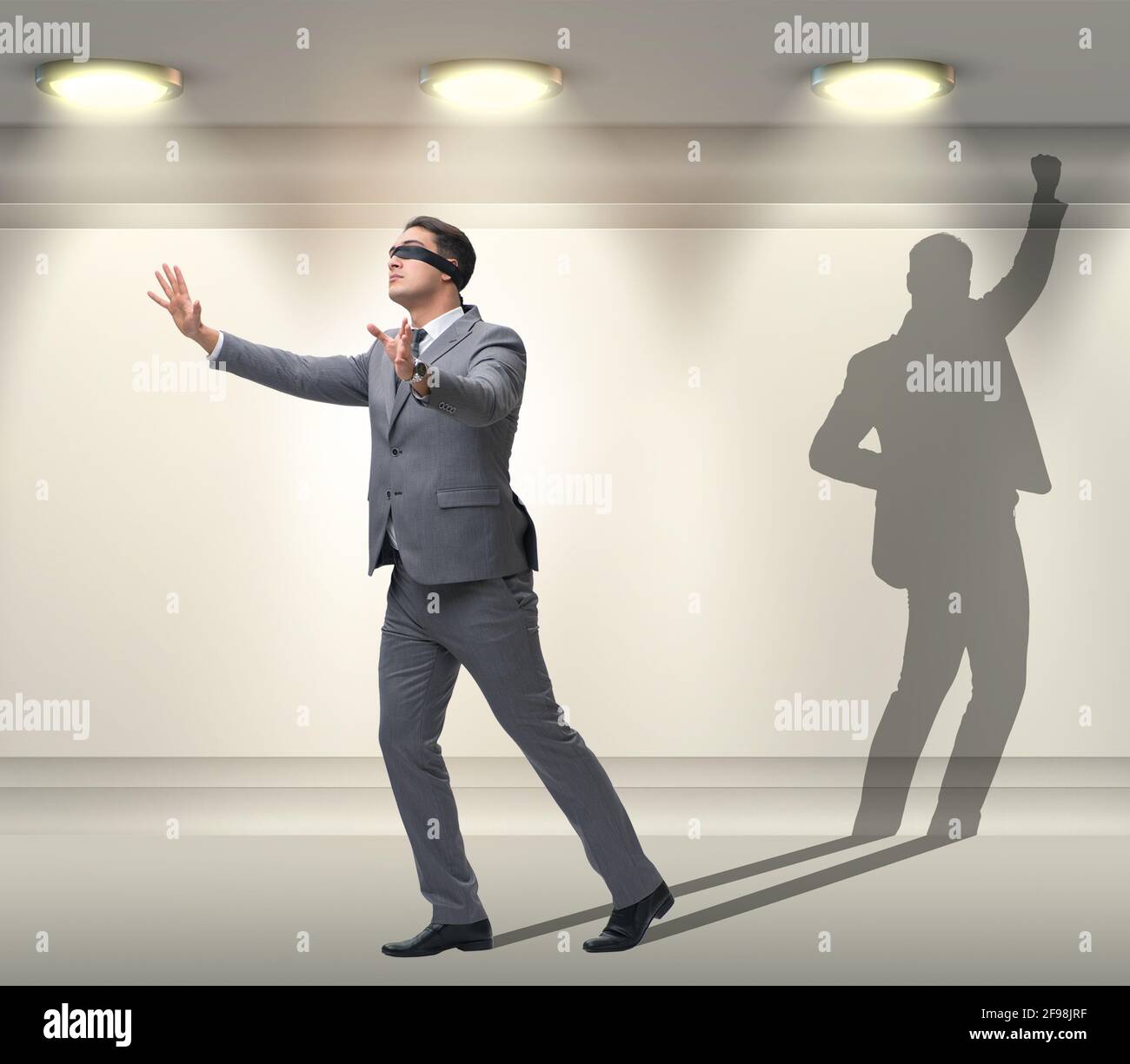 The businessman and his shadow in business concept Stock Photo - Alamy
