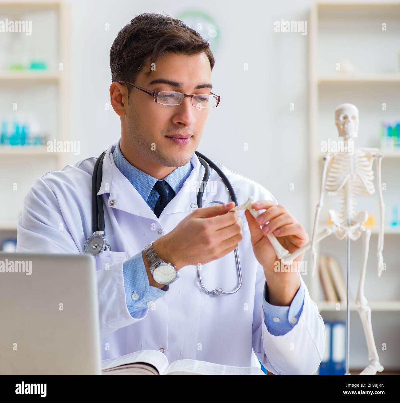 The doctor student studying the bones of skeleton Stock Photo - Alamy
