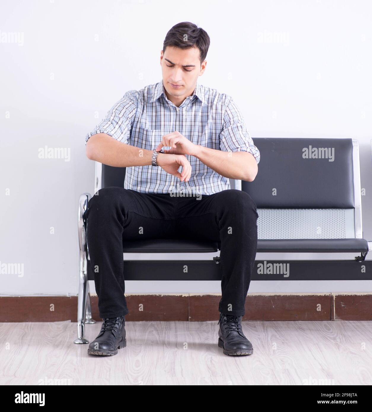 The man nervously impatiently waiting in the lobby Stock Photo - Alamy