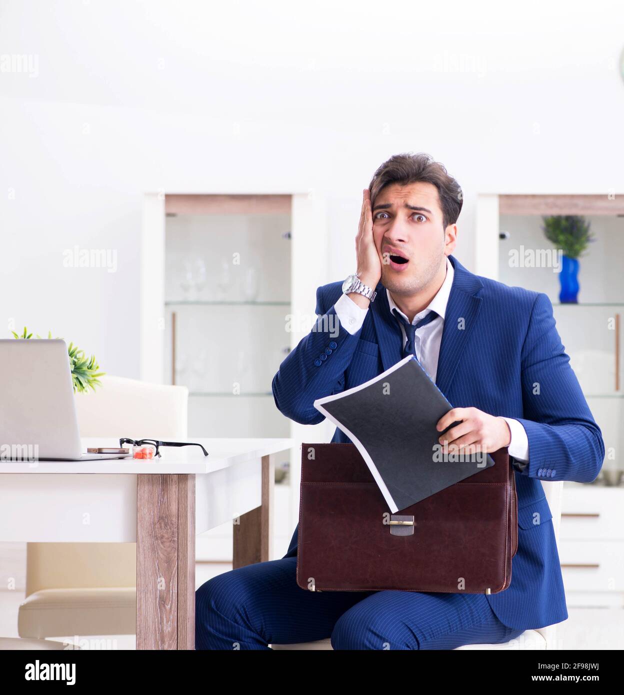The bankrupt businessman angry and upset at home Stock Photo - Alamy