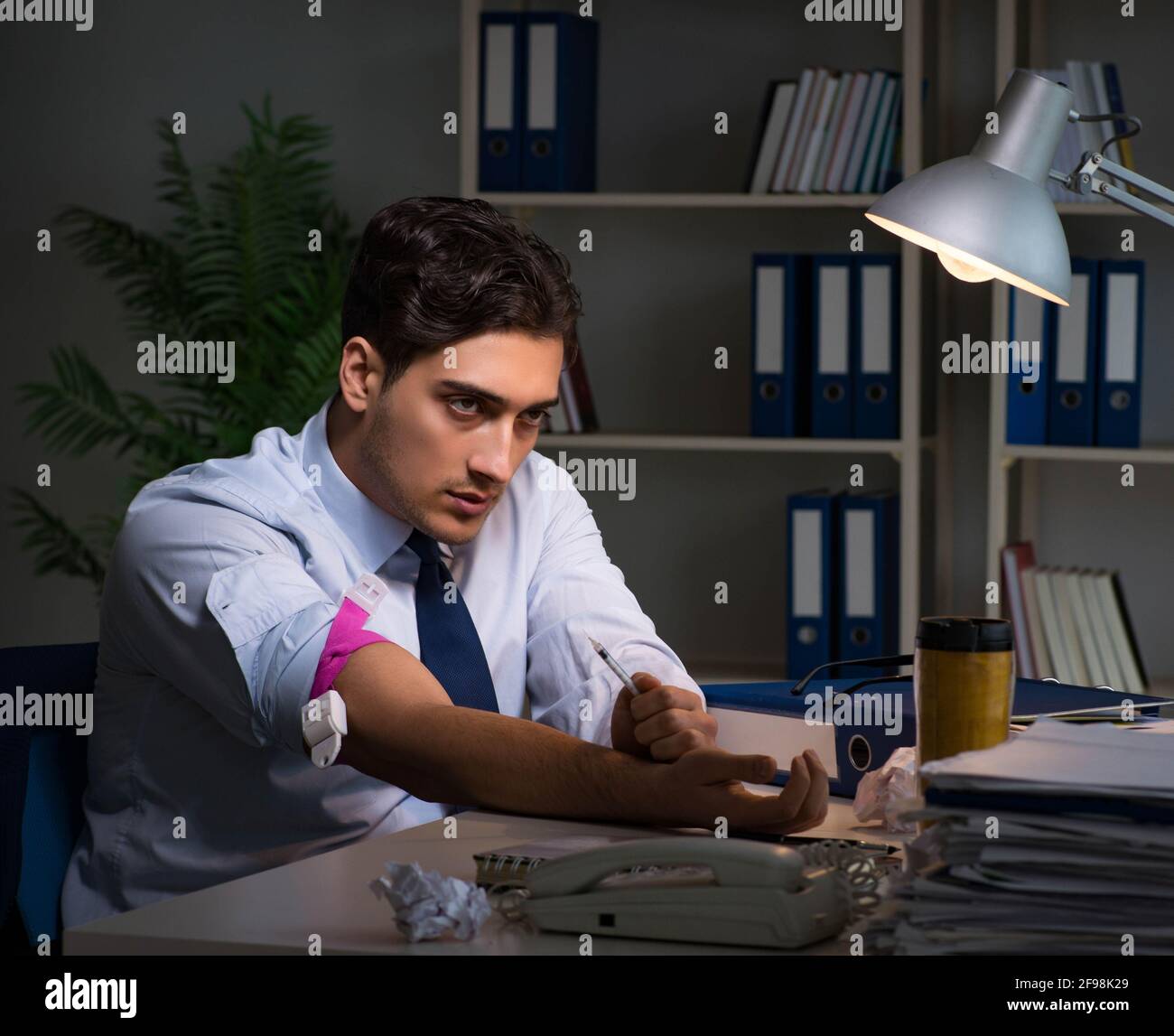 The employee relieving stress from overtime with drugs narcotics Stock ...