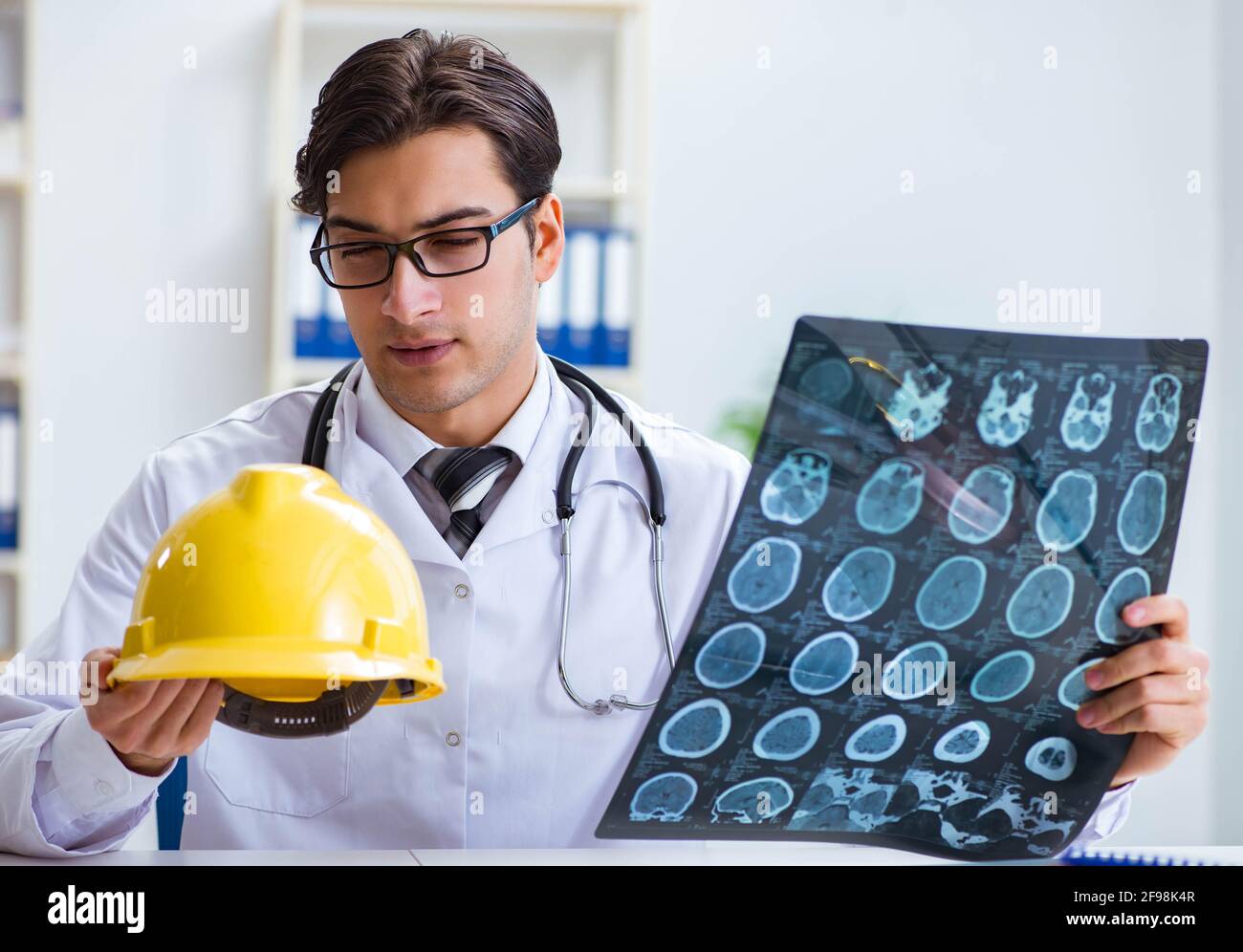 The safety doctor advising about wearing hard hat Stock Photo - Alamy