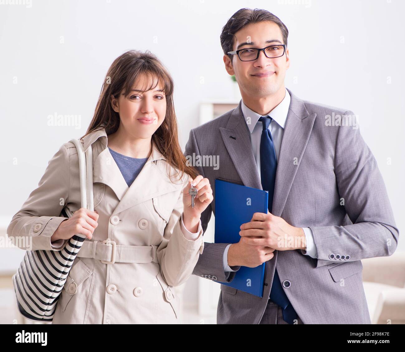 The real estate agent showing new apartment property to client Stock ...
