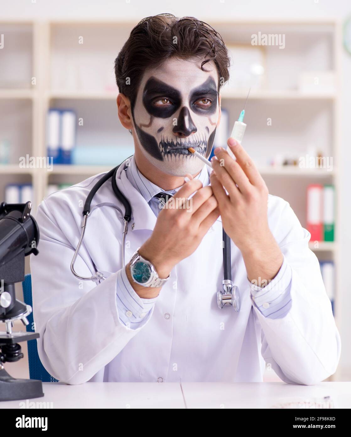The scary monster doctor working in lab Stock Photo - Alamy