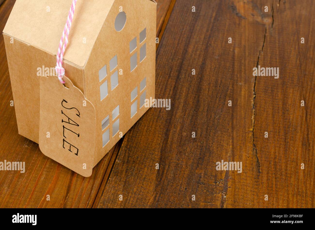 Real estate sale concept, paper model of residential building. Studio ...