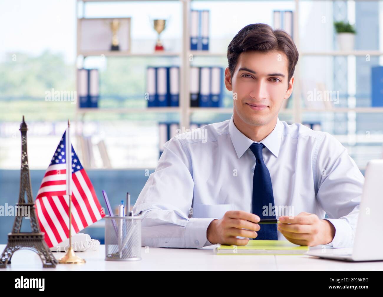 The sales agent working in travel agency Stock Photo - Alamy