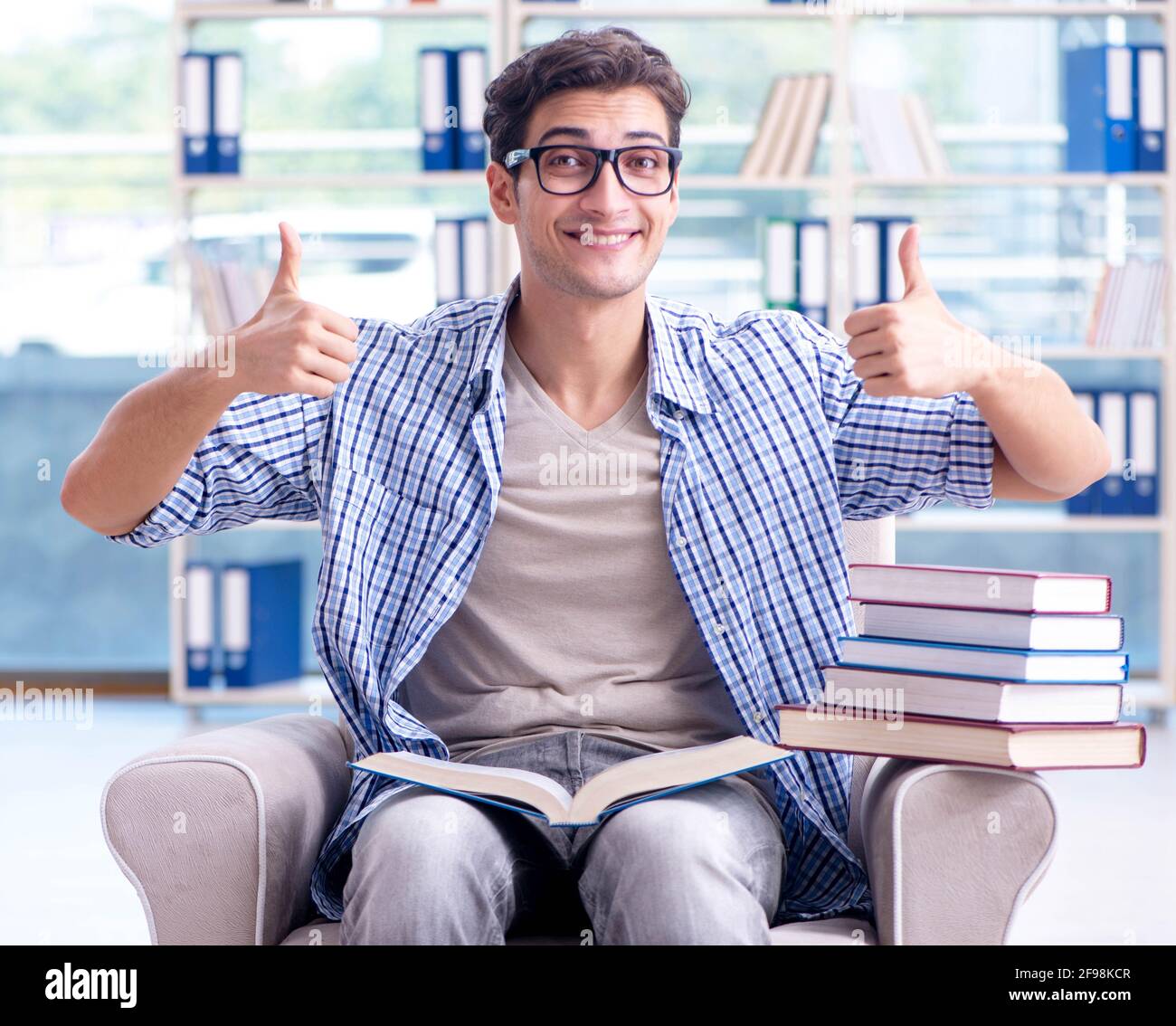The student reading books and preparing for exams in library Stock ...