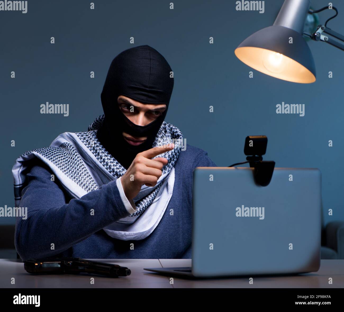 The hacker wearing balaclava mask hacking computer Stock Photo - Alamy