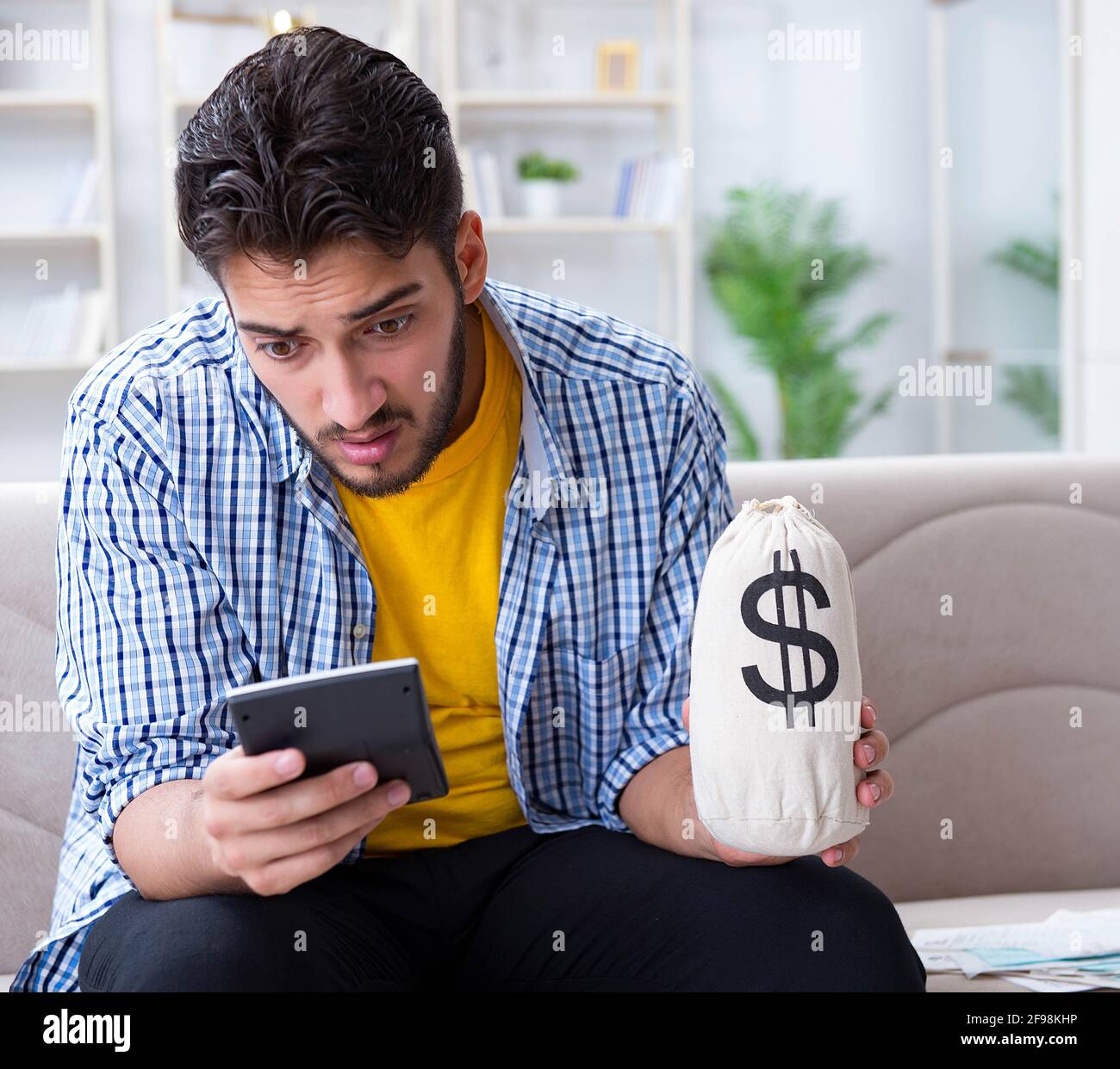 The man angry at bills he needs to pay Stock Photo - Alamy