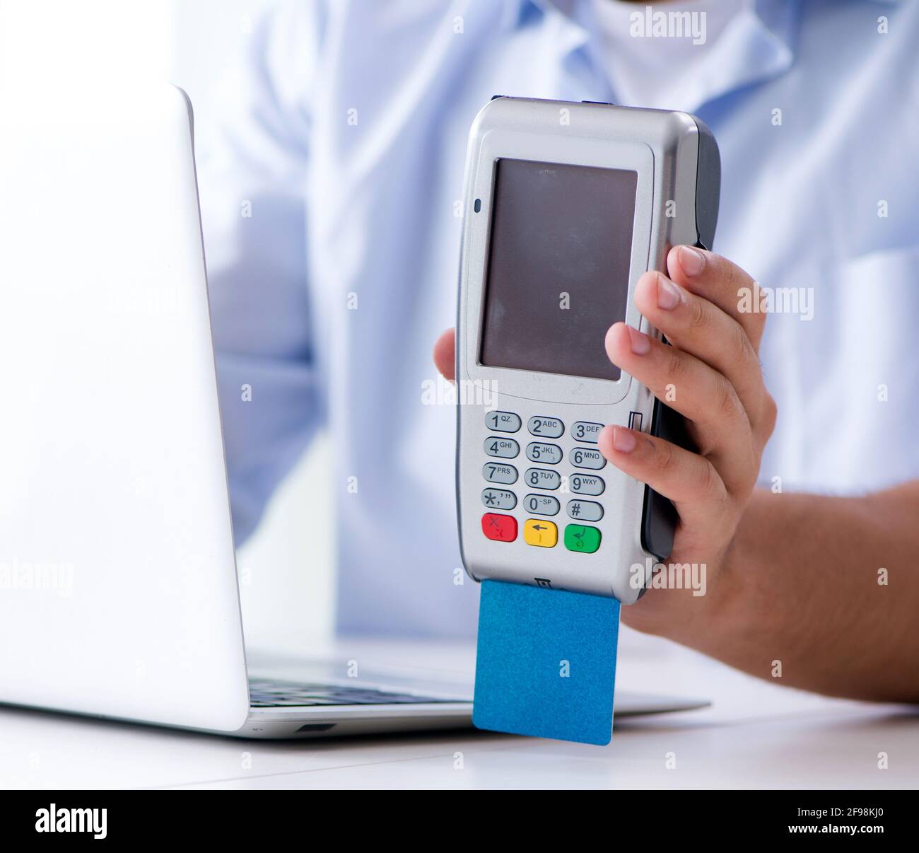 The man processing credit card transaction with pos terminal Stock ...