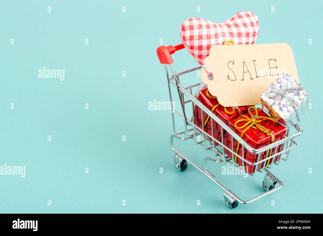 Seasonal sales. Shopping cart shopping cart on bright background ...