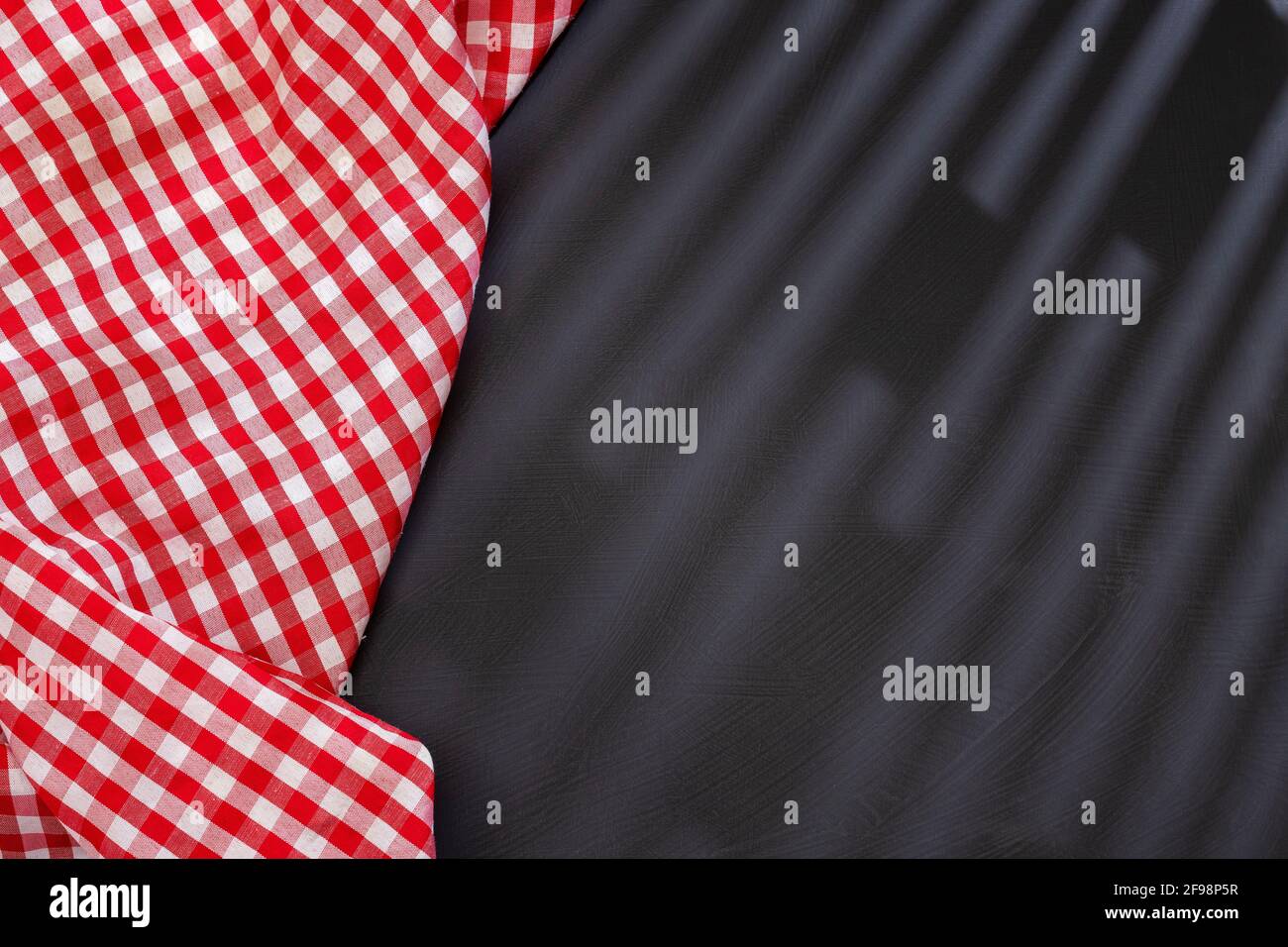 Dark rustic background with red checkered napkin - text space Stock ...