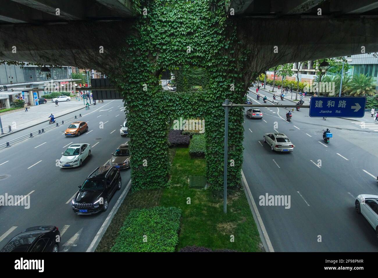 Chengdu, China. 16th Apr, 2021. - Pedestrians walk under the viaduct of ...