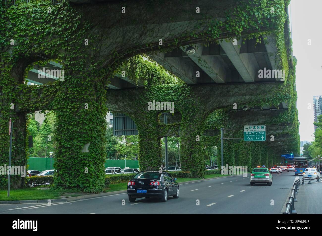 Chengdu, China. 16th Apr, 2021. - Pedestrians walk under the viaduct of ...