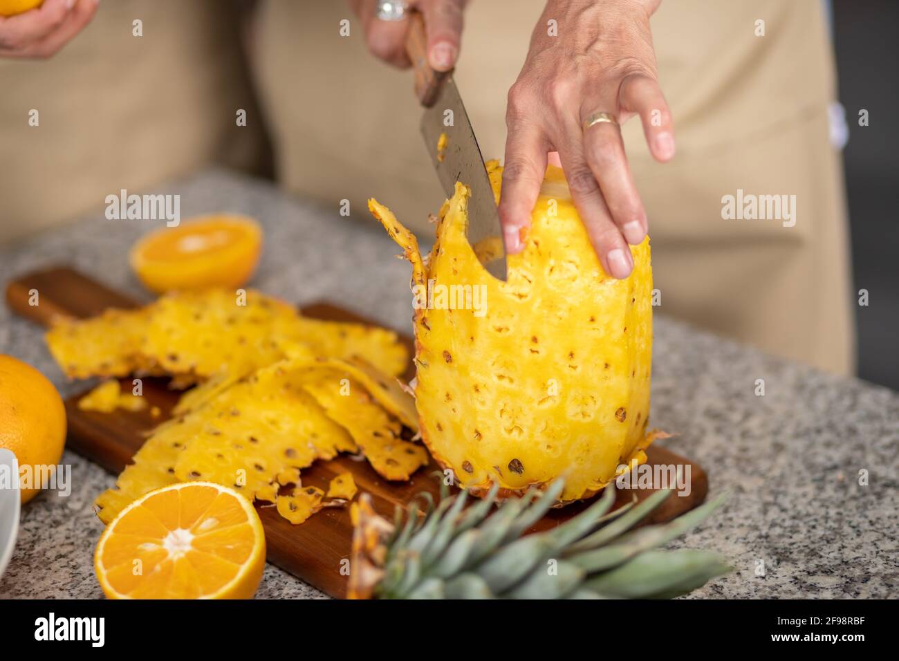 Womans hands cutting fresh orange hi-res stock photography and images ...