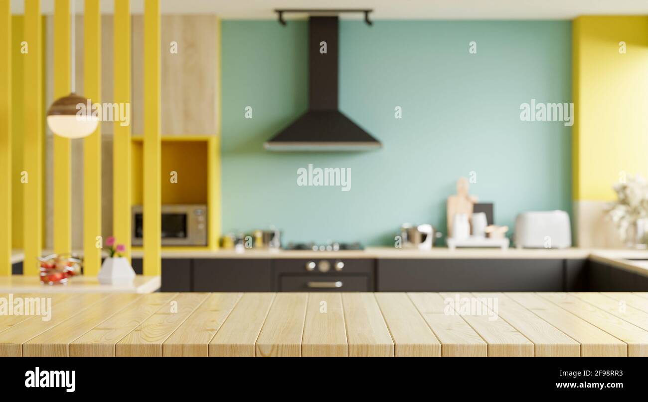 Empty wooden table and blurred kitchen yellow wall background/Wood ...