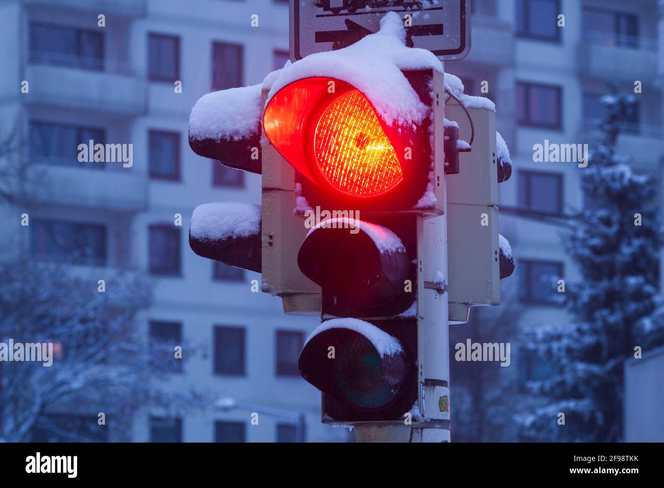 Snow covered traffic lights switched to red hi-res stock photography ...