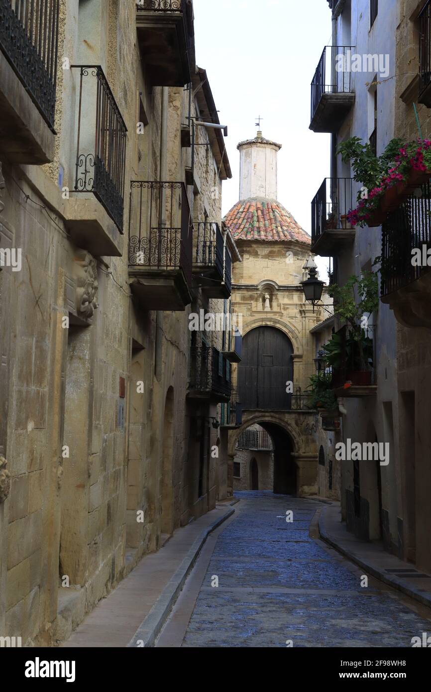 Vertical shot of alleyway along old buildings in Calaceite, Spain Stock ...
