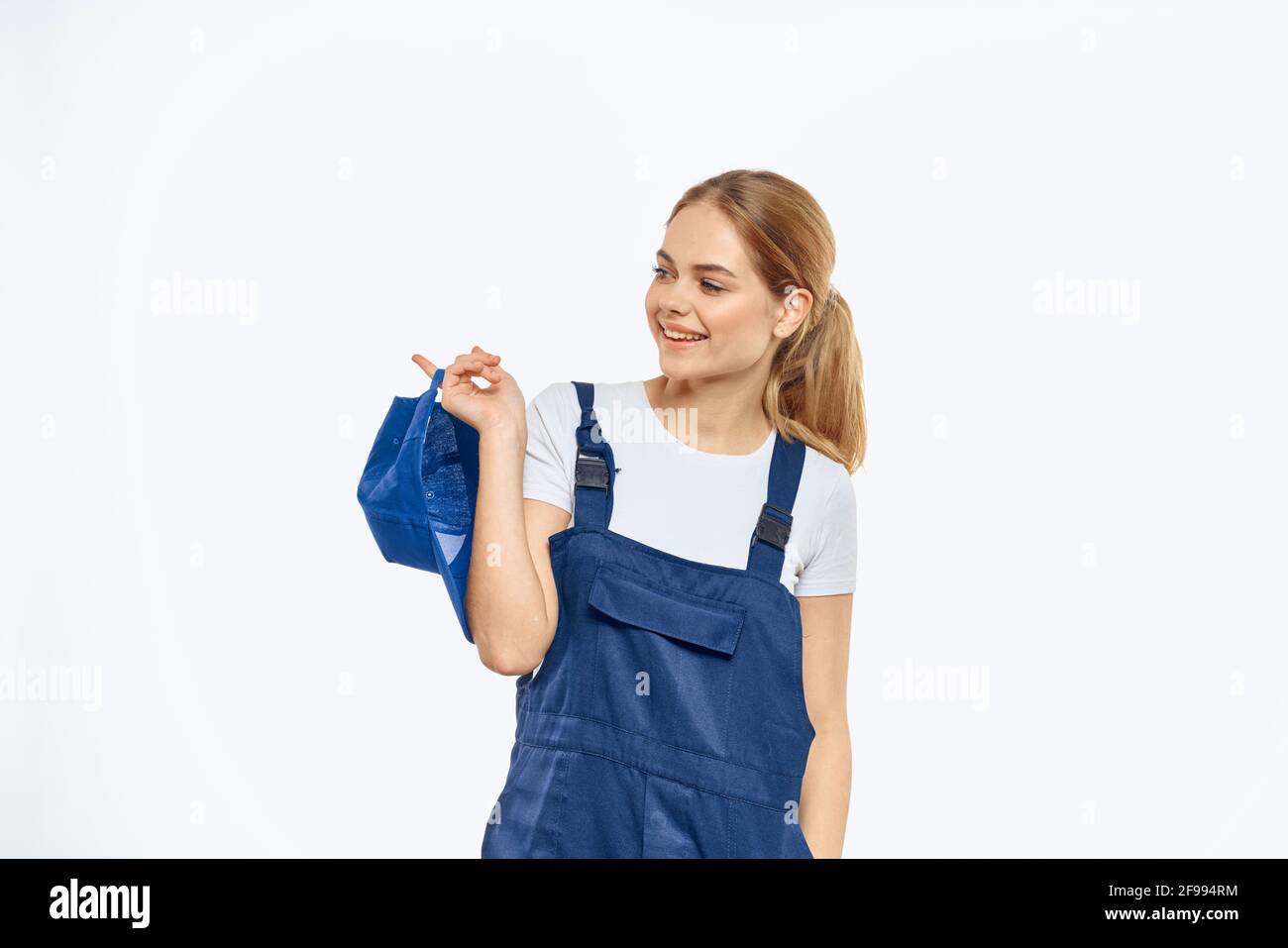 women in blue cap service professionals working Stock Photo - Alamy