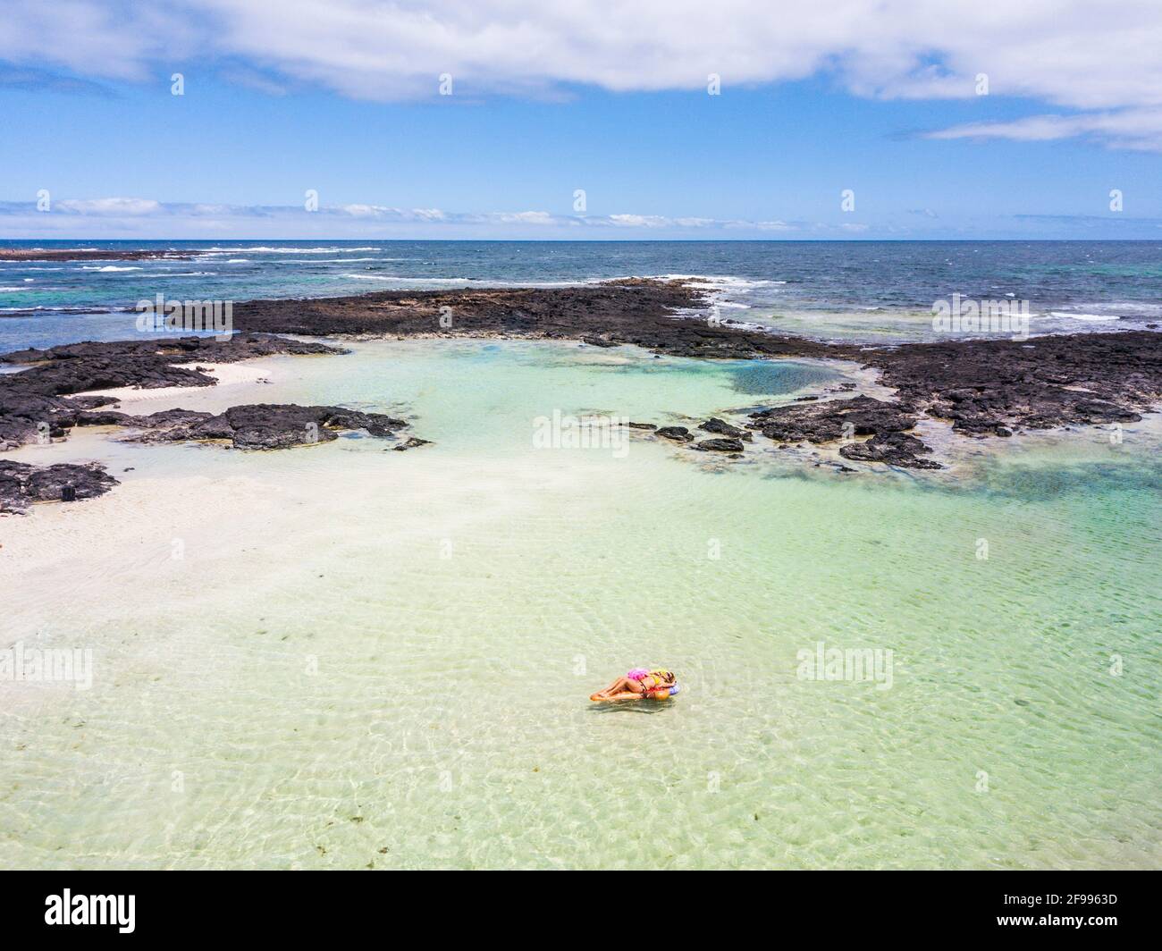 Woman sunbathing on lilo in hi-res stock photography and images - Alamy