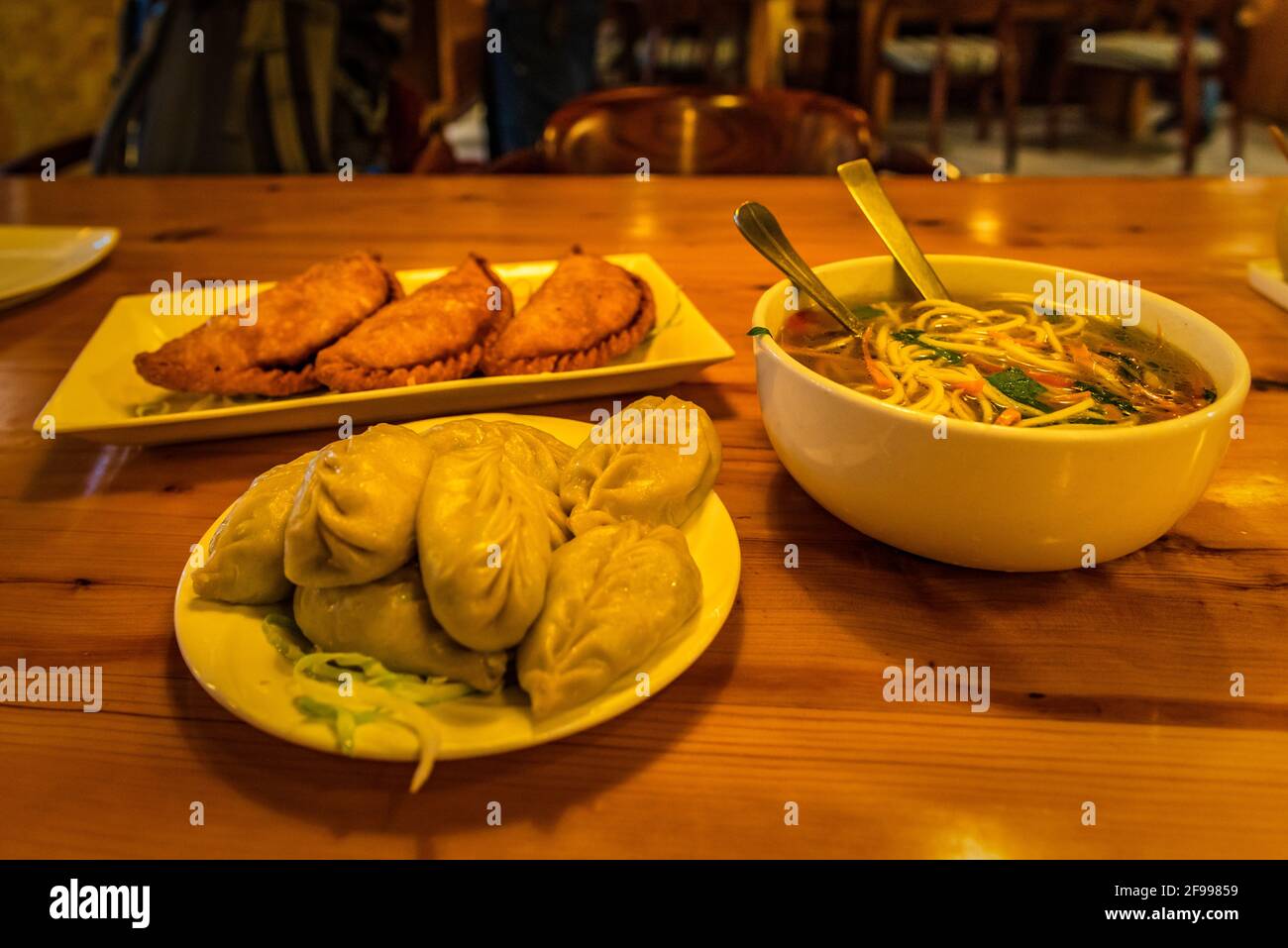 Selective view of tibetian traditional food dishes momos, thukpa and ...