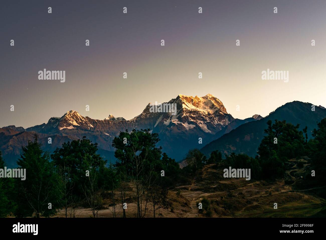 Mystical Chaukhamba peaks of Garhwal Himalayas during twilight from ...