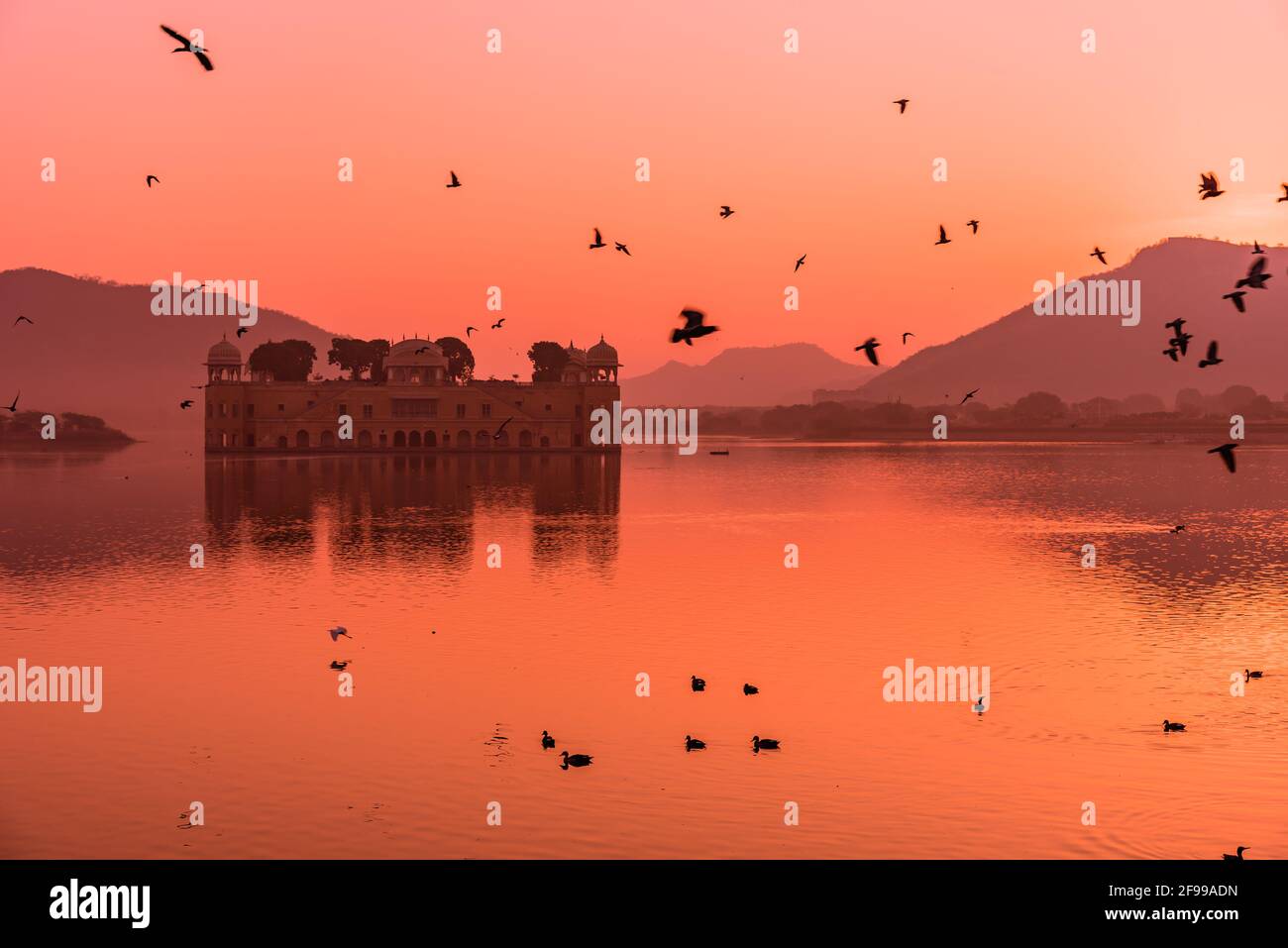 Panoramic view during Sunrise at the Jal Mahal 'Water Palace'. It is an ...