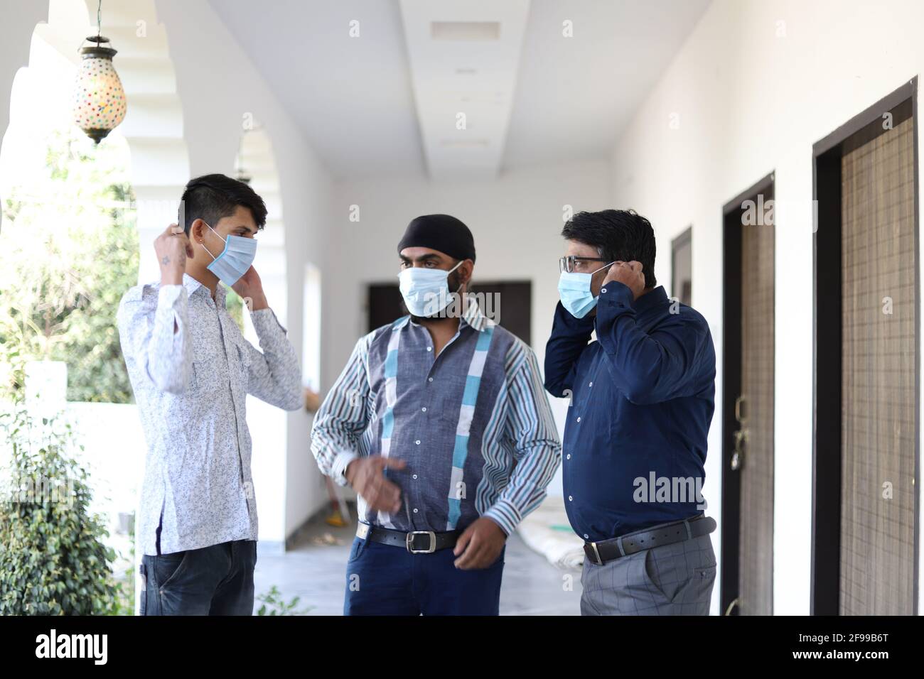 Shallow focus of Asian men observing basic health protocols against ...