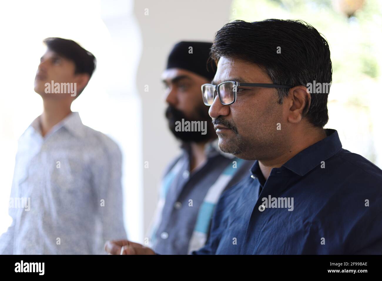 Shallow focus shot of three Indian men, standing outdoors Stock Photo ...