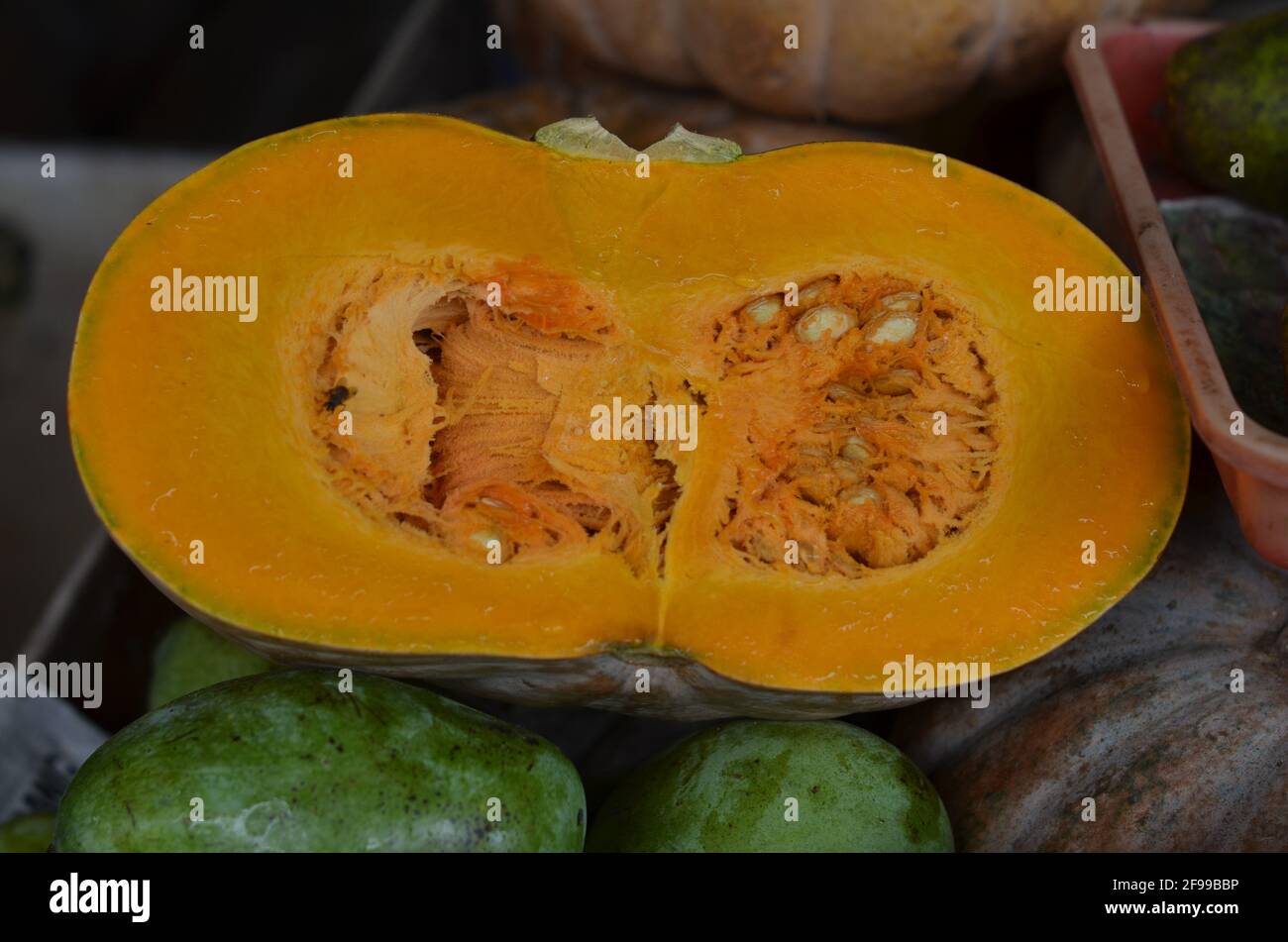 Pumpkin fruit that has been split orange Stock Photo - Alamy