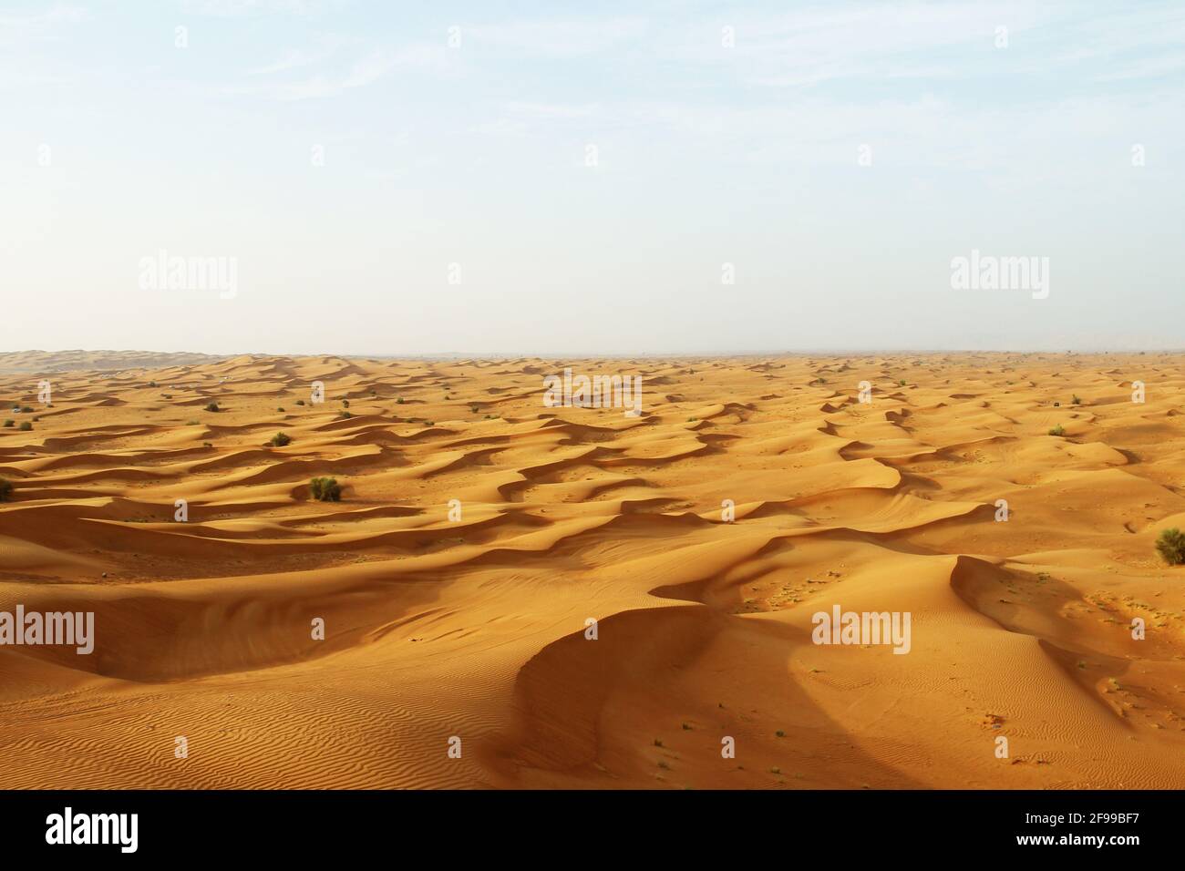 Sand dunes and blue sky. Desert landscape in Dubai, UAE Stock Photo - Alamy